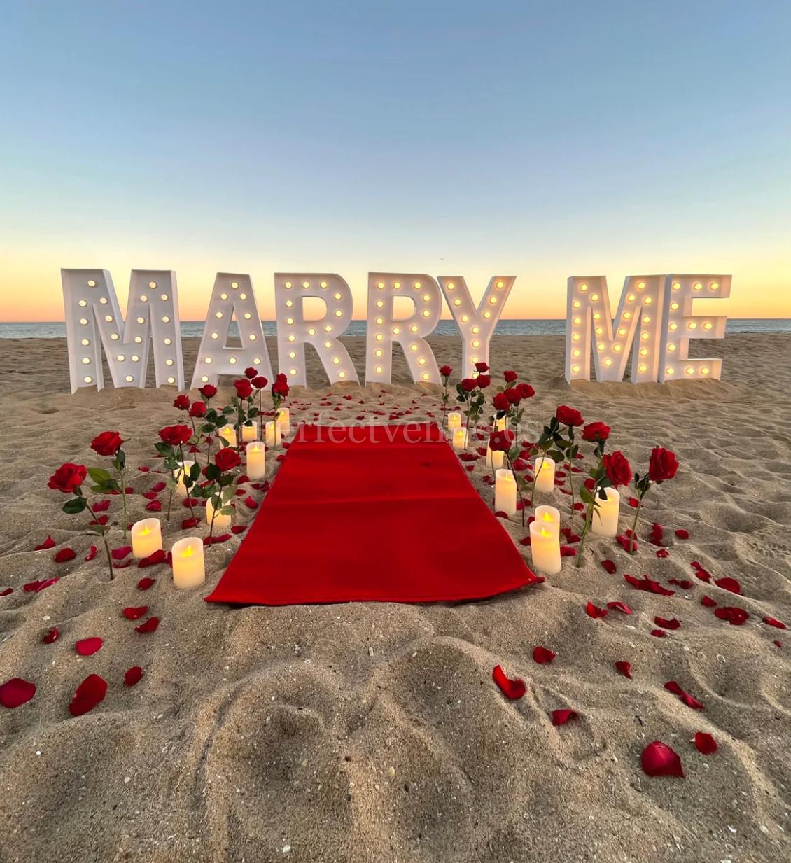 Rooftop marriage proposal with big letters Marry Me, Barcelona